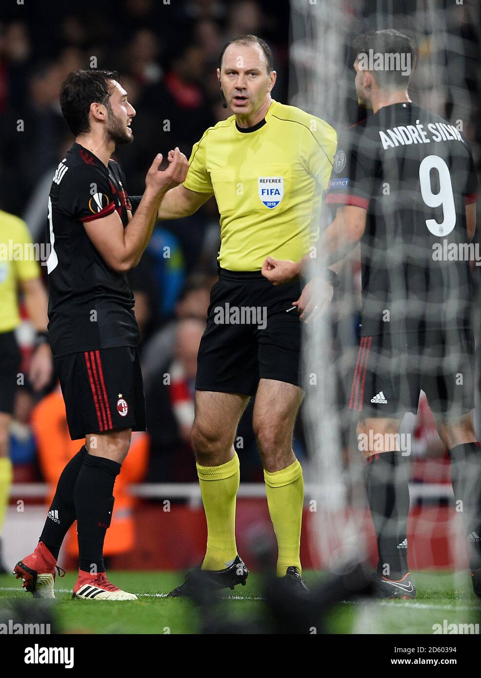 AC Milan Miguel Andre Silva (right) complains to an official after ...