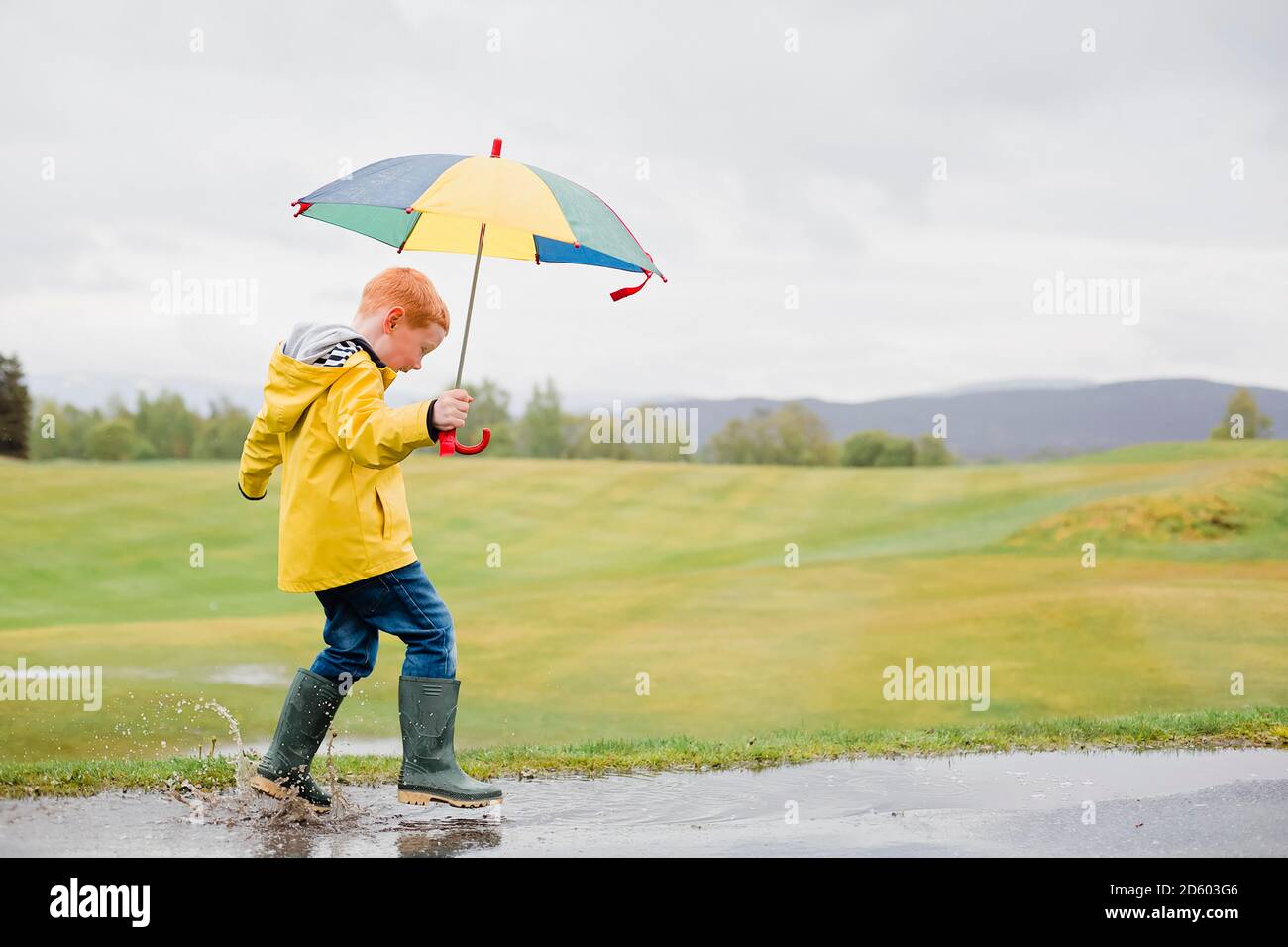 Playing in the rain hi-res stock photography and images - Alamy