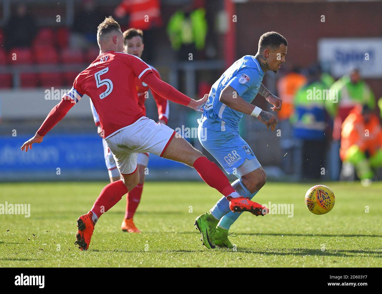 Coventry City's Jonson Clarke-Harris (right) is fouled by Crew ...