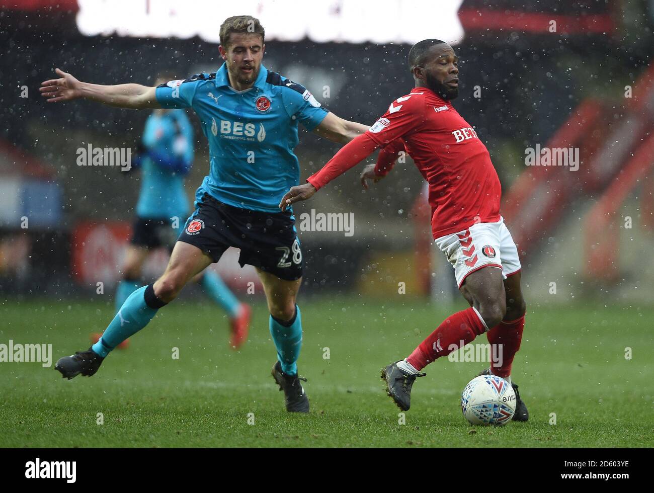 Fleetwood Town's Jack Sowerby (left) holds back Charlton Athletic's ...