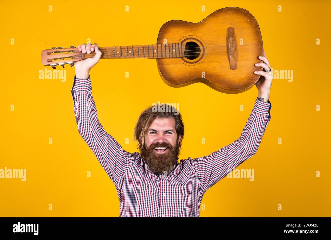mature hipster musician with beard. brutal caucasian guy playing guitar ...