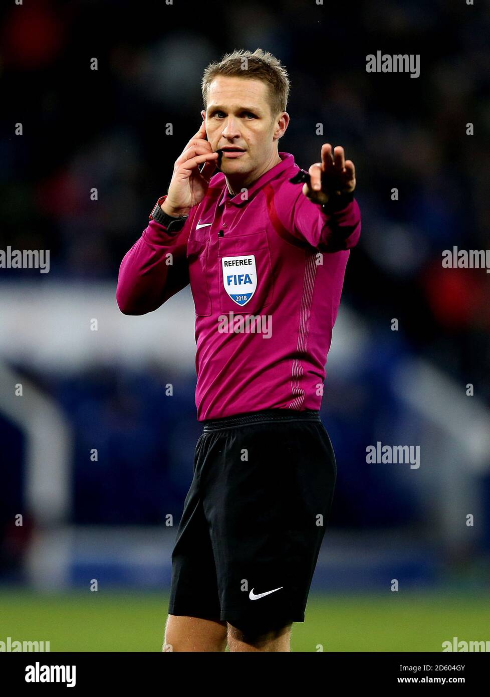 Match referee Craig Pawson checks with the Video Assistant Referee ...