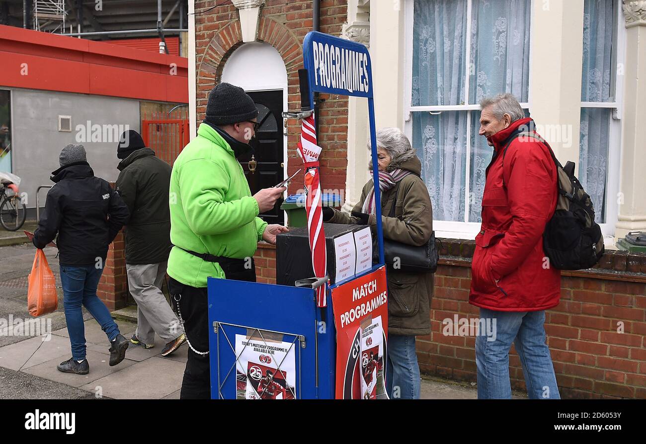 Programme seller outside The Valley Stadium Stock Photo - Alamy