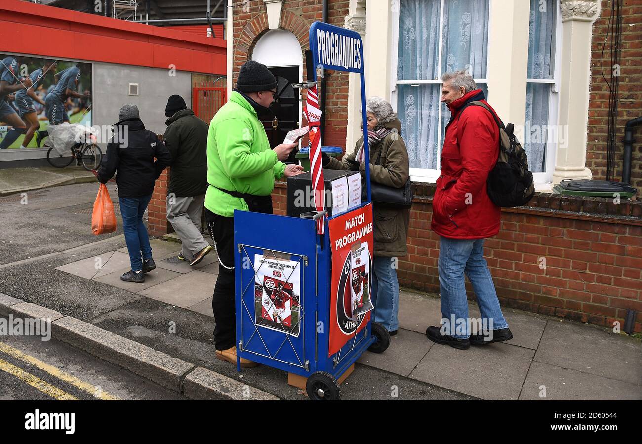 Programme seller outside The Valley Stadium Stock Photo - Alamy