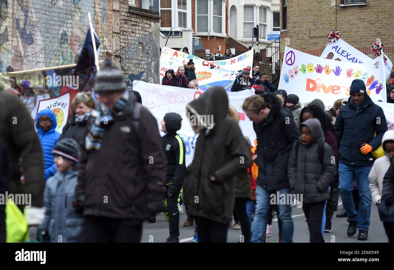 Red, white and black day procession on route to the Valley from ...