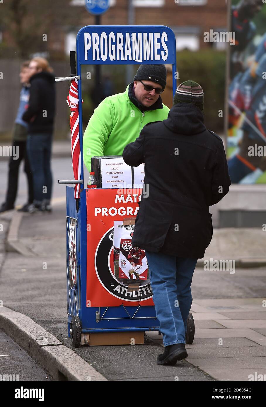 Programme seller outside The Valley Stadium Stock Photo - Alamy