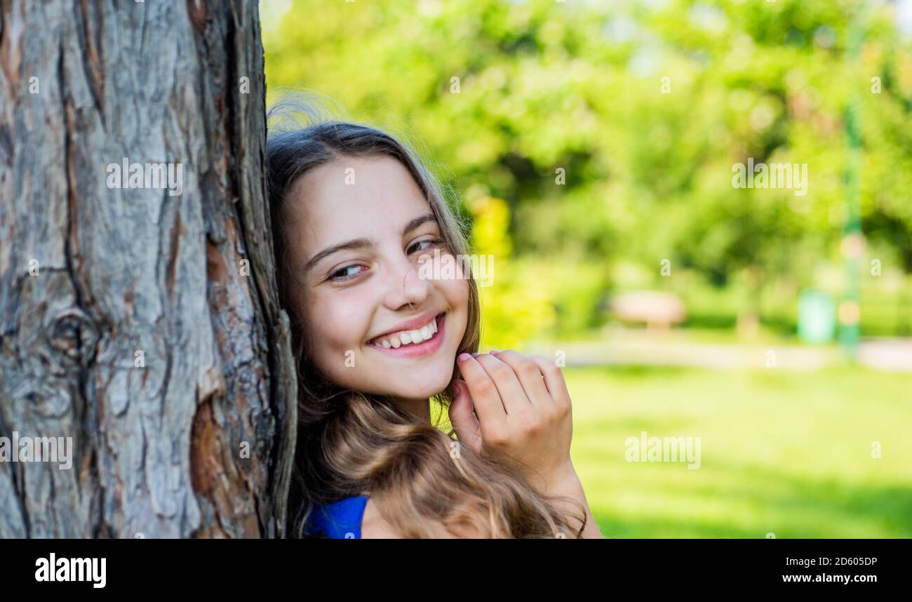 Always smiling. Happy girl smile at tree on summer landscape. Dental ...