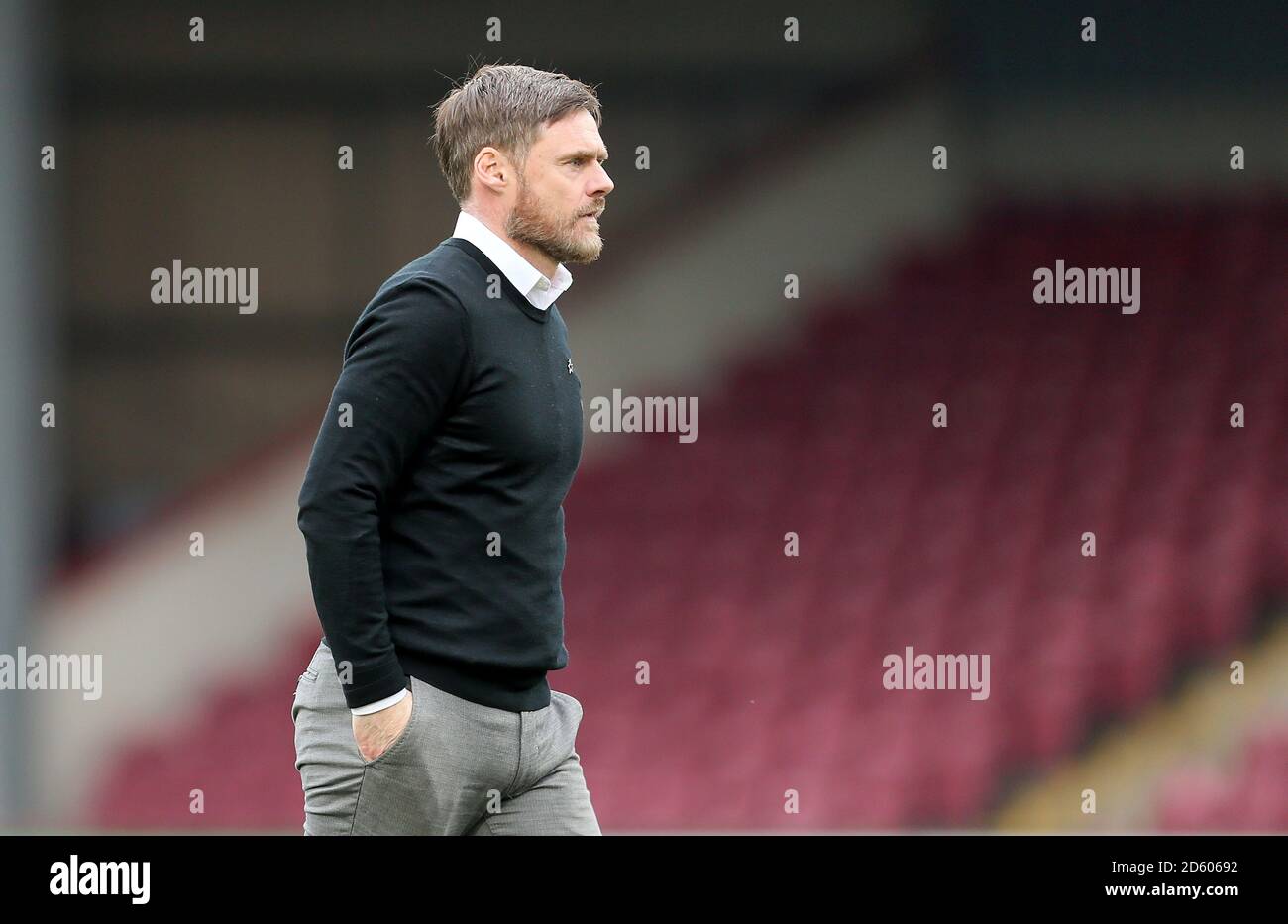 Scunthorpe United's Manager, Graham Alexander walks off after the 1-1 ...
