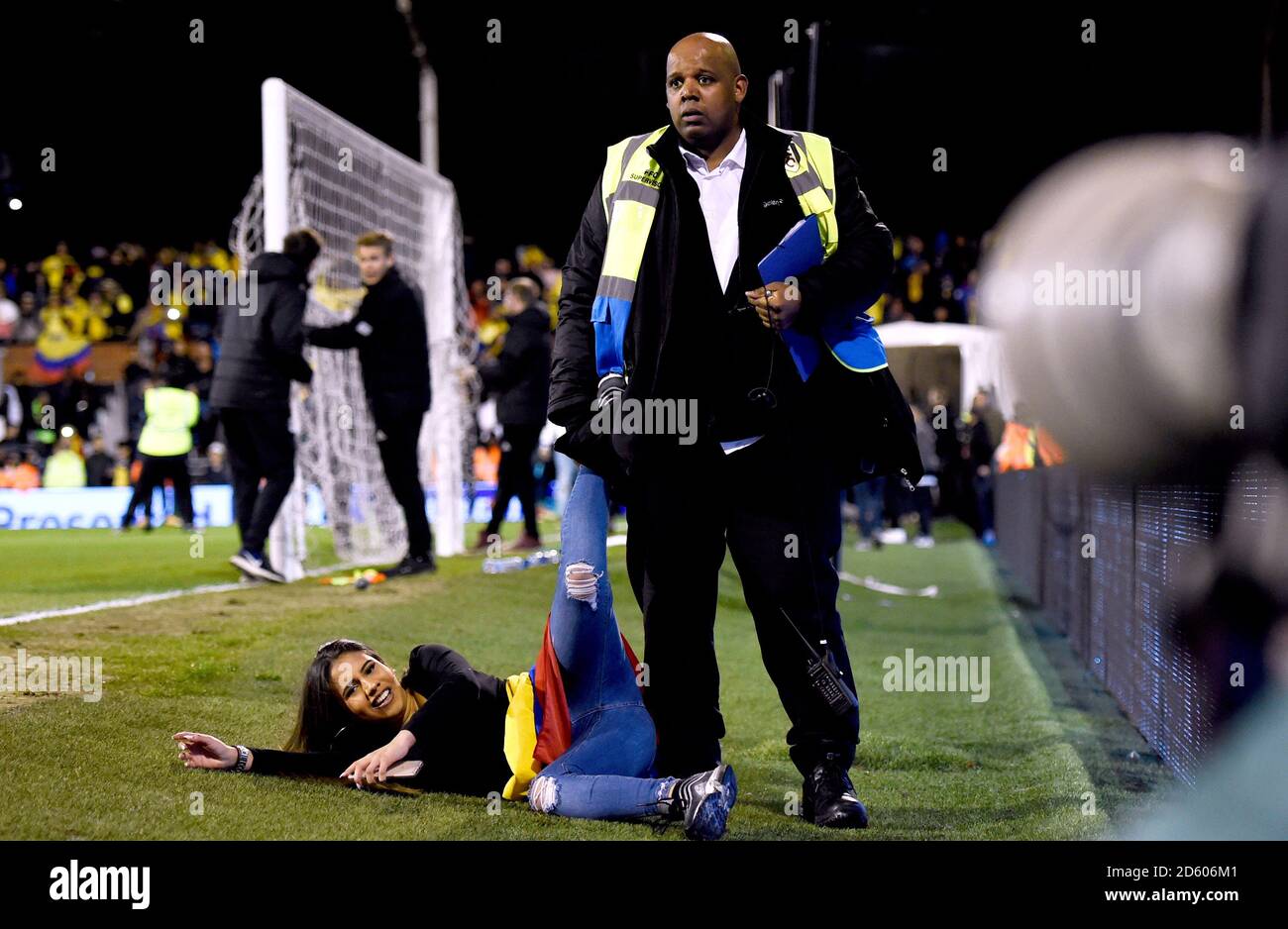 Stewards with pitch invaders after the game Stock Photo - Alamy