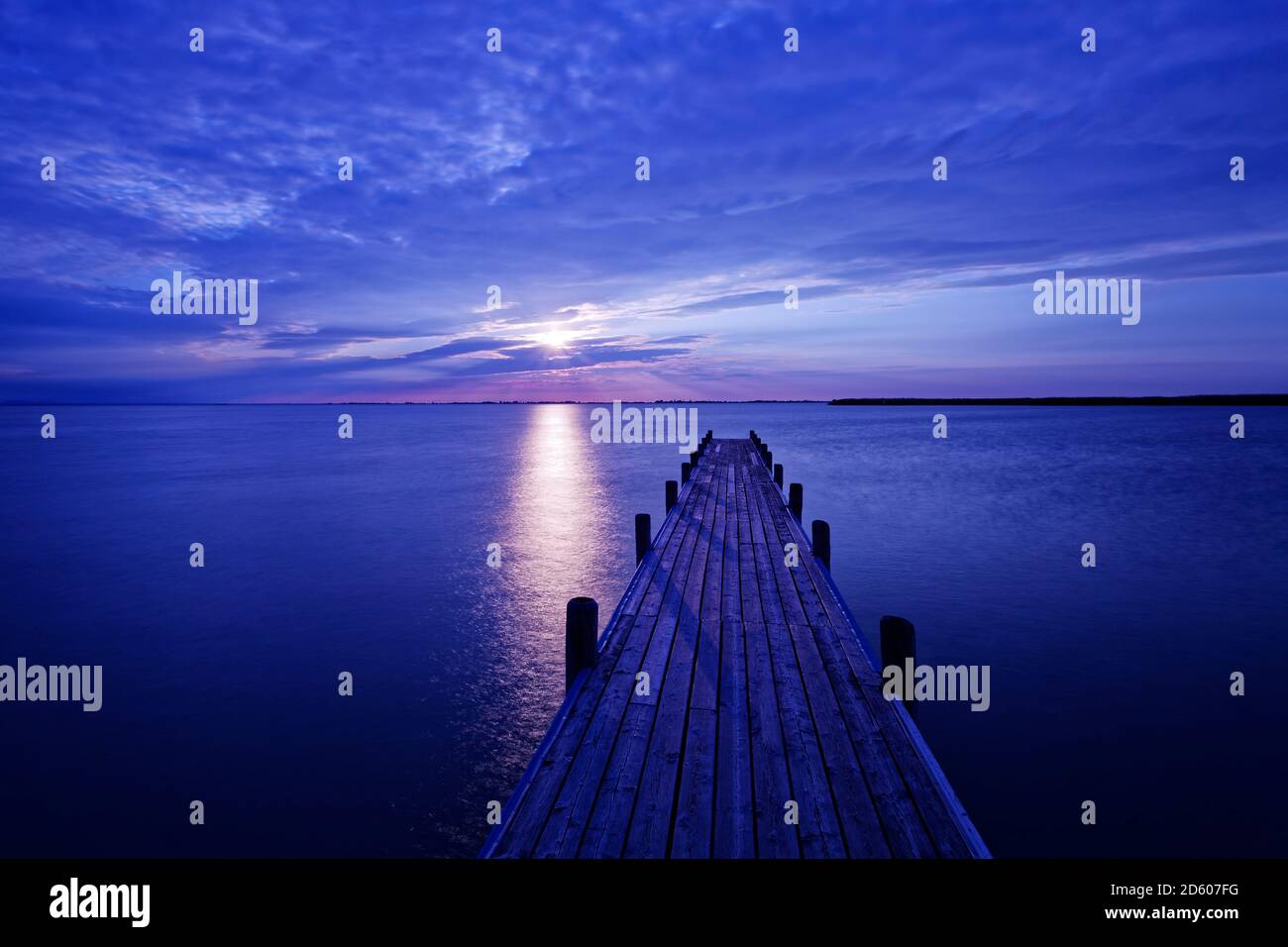 Austria, Burgenland, Moerbisch am See, View of dock on Lake Neusiedl at ...