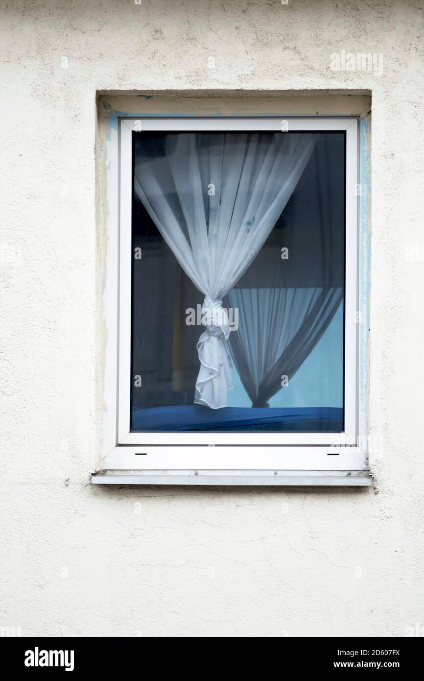 Window with tied curtain Stock Photo - Alamy