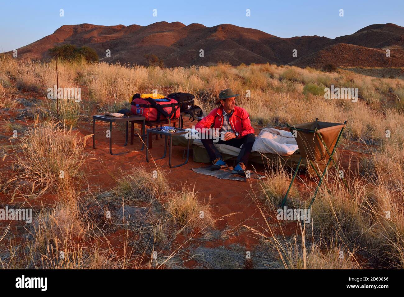 Namibia, Namib Desert, man at Schafberg Camp on Tok Tokkie Trail Stock ...