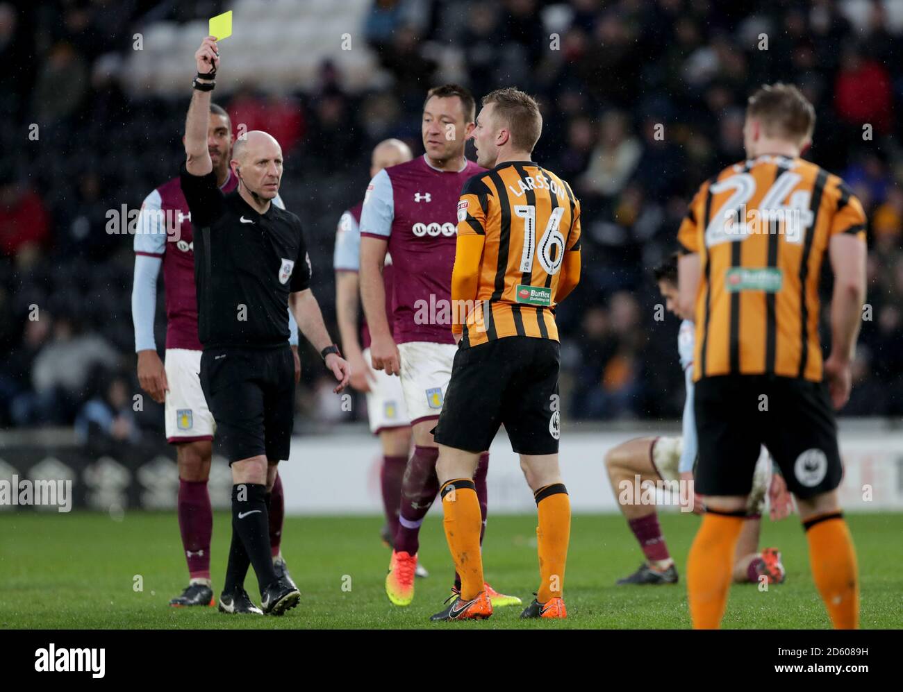 Referee Andy Davies books Hull City's Sebastian Larsson Stock Photo - Alamy