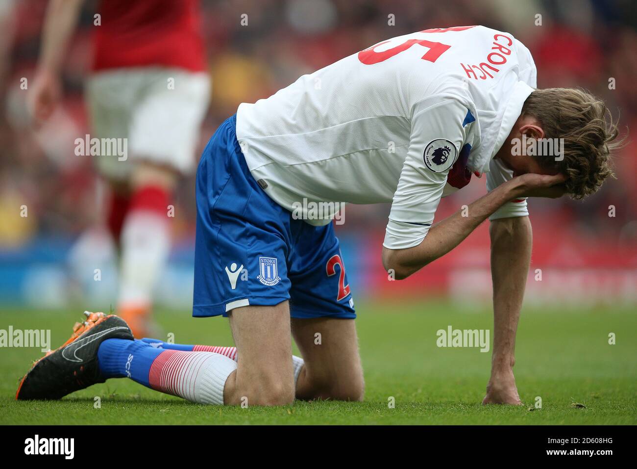 Stoke City's Peter Crouch holds his head after a challenge Stock Photo ...