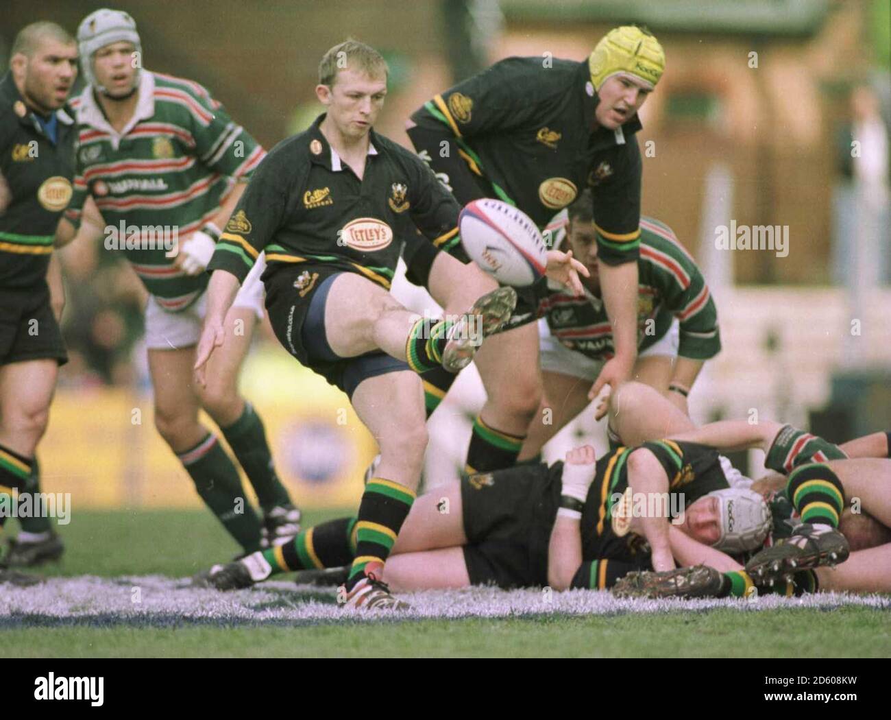 Northampton's Matt Dawson (c) clears the ball on his first game back ...