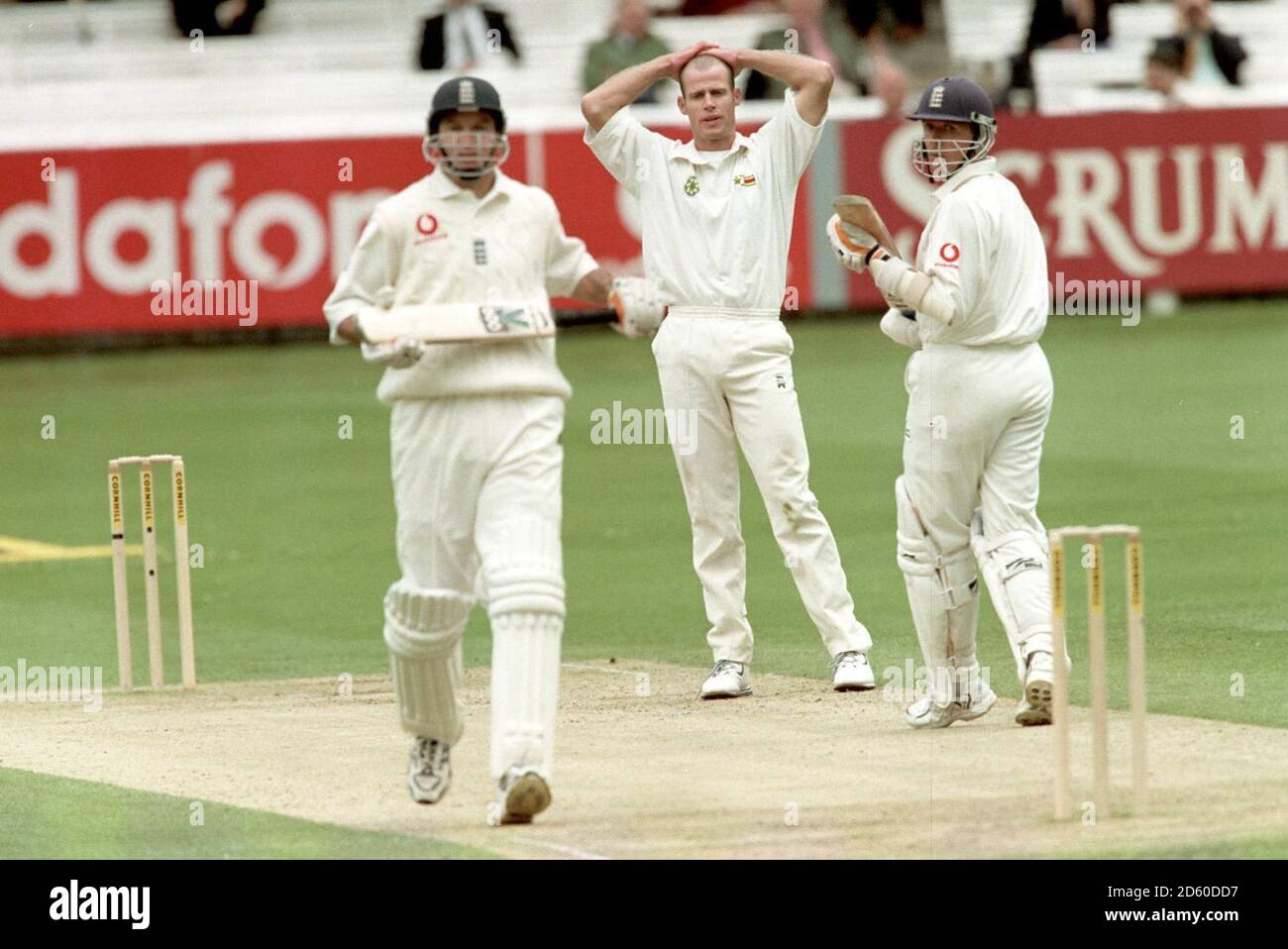 Zimbabwe's Neil Johnson holds his head in frustration as Alec Stewart ...