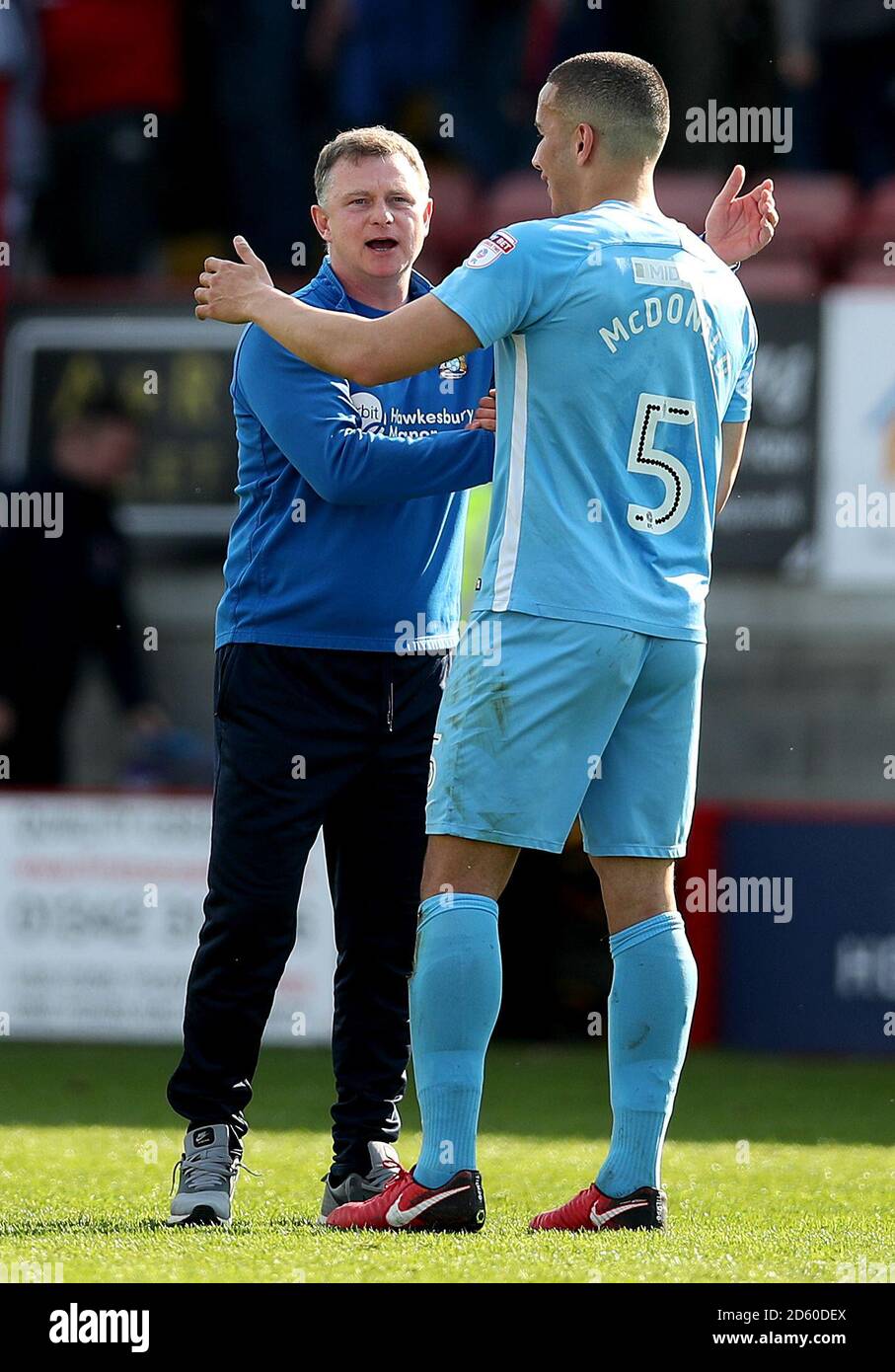 Coventry City manager Mark Robins (left) celebrates after the game with ...