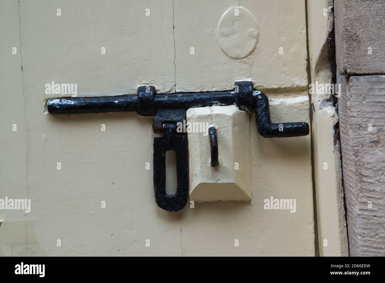An old iron locking crank bolt Stock Photo - Alamy