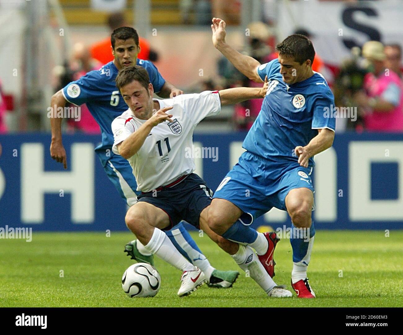 Paraguay's Roberto Acuna and England's Joe Cole battle for the ball ...