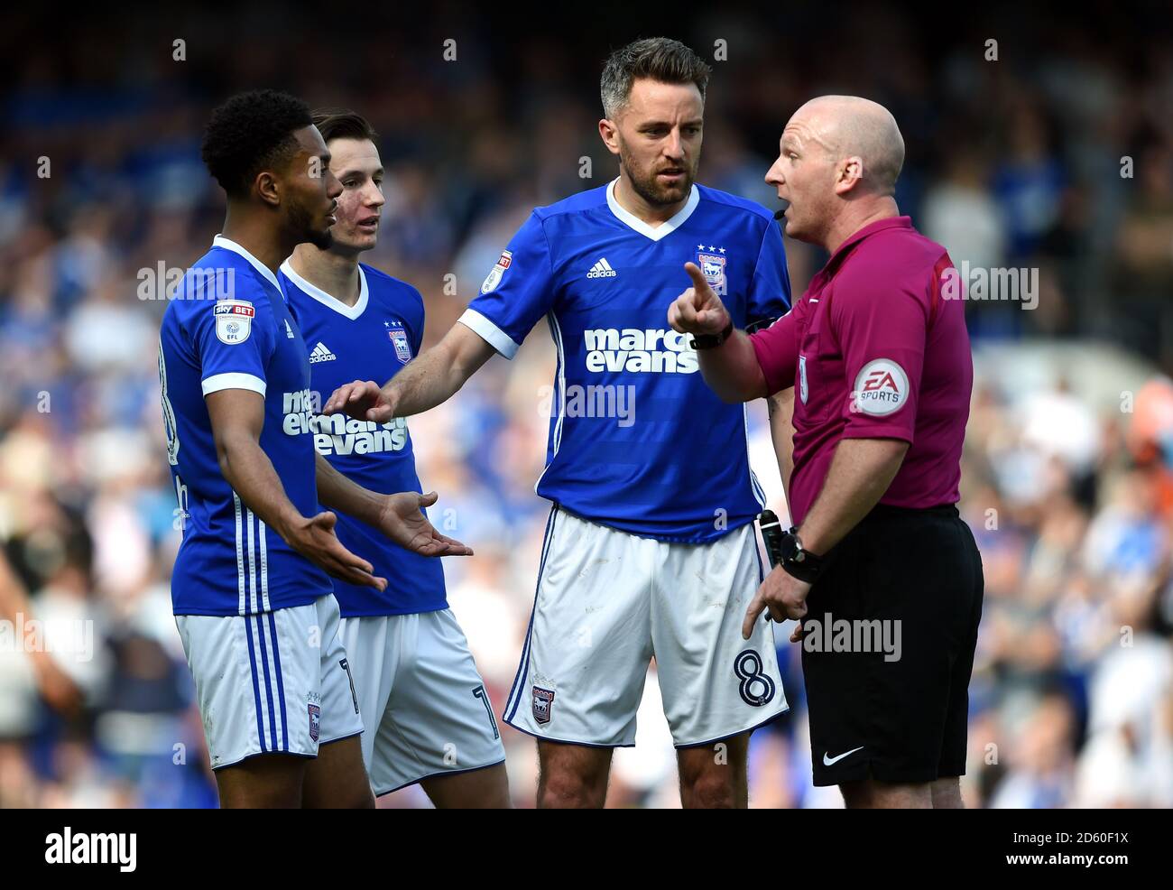 Ipswich Town's Grant Ward (left) is shown a red card by referee Simon ...