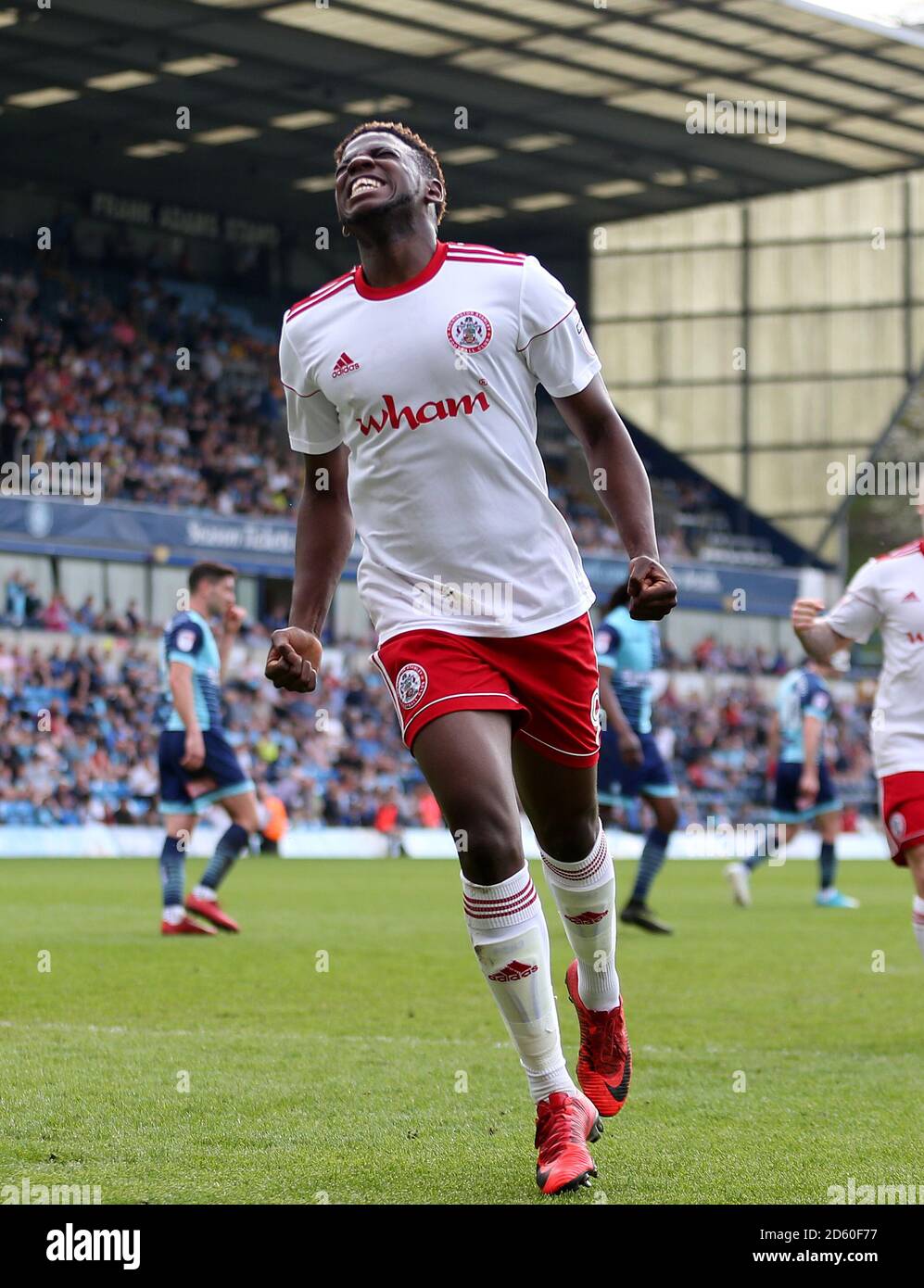 Accrington Stanley Offrande Zanzala celebrates scoring his sides fourth ...