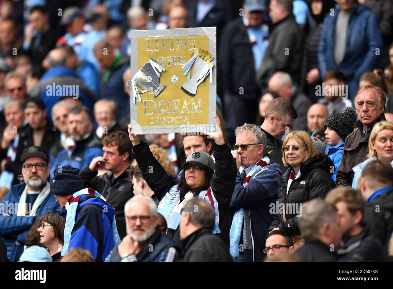 Manchester City fans hold signs prior to kick off Stock Photo - Alamy
