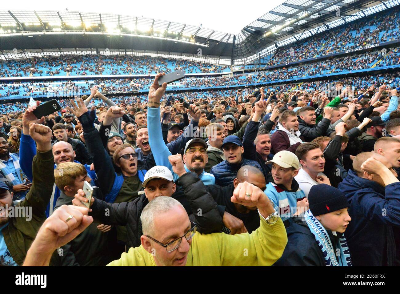 Fans invade the pitch after the final whistle Stock Photo - Alamy