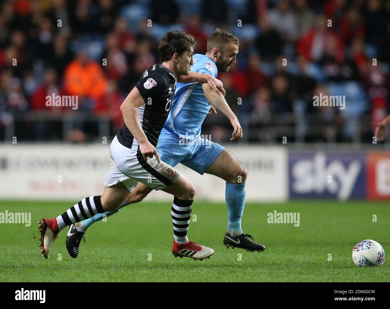 Coventry City's Liam Kelly (right) and Lincoln City's Alex Woodyard ...
