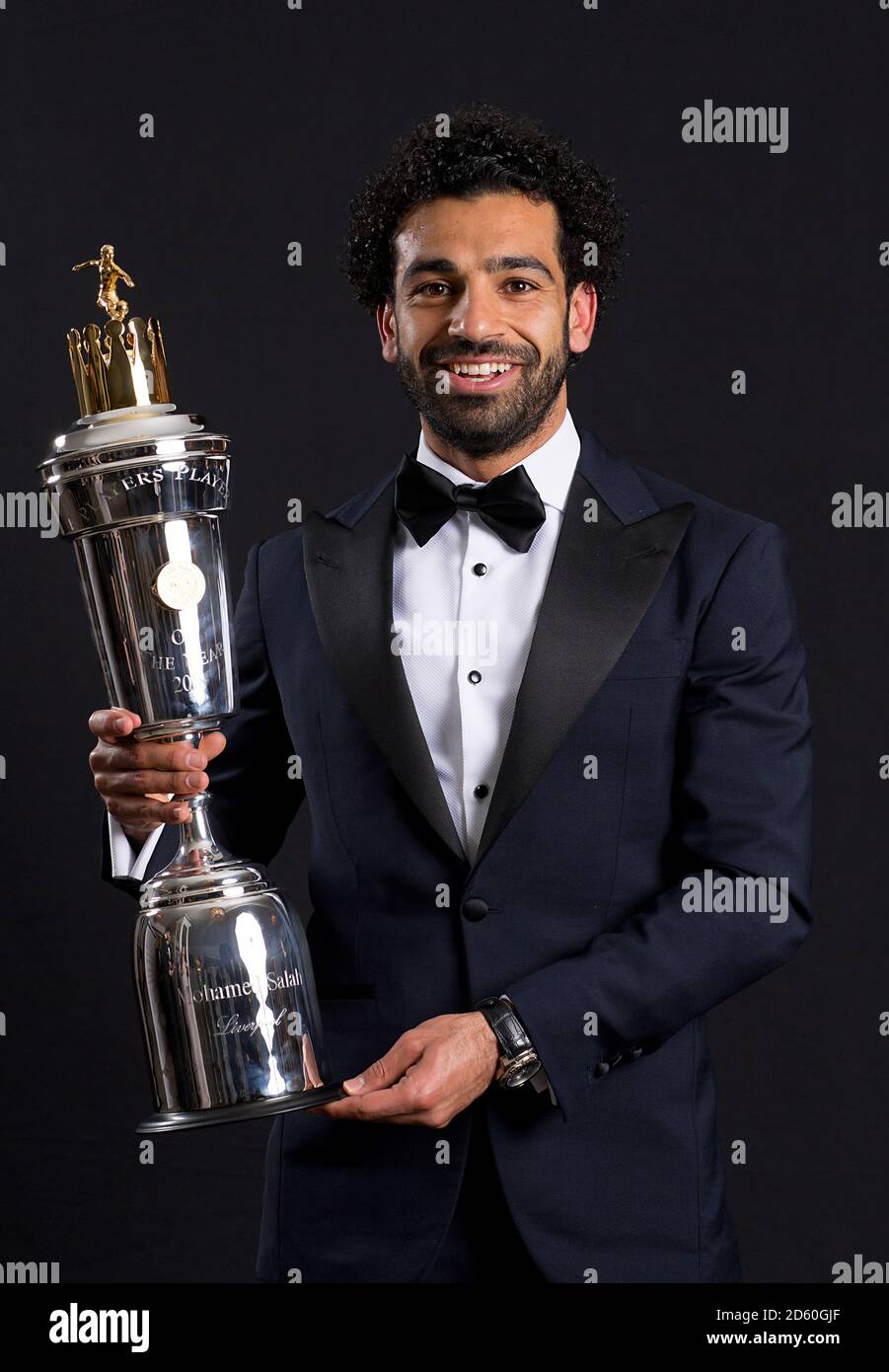 Liverpool's Mohamed Salah poses with the PFA Player Of The Year Award ...