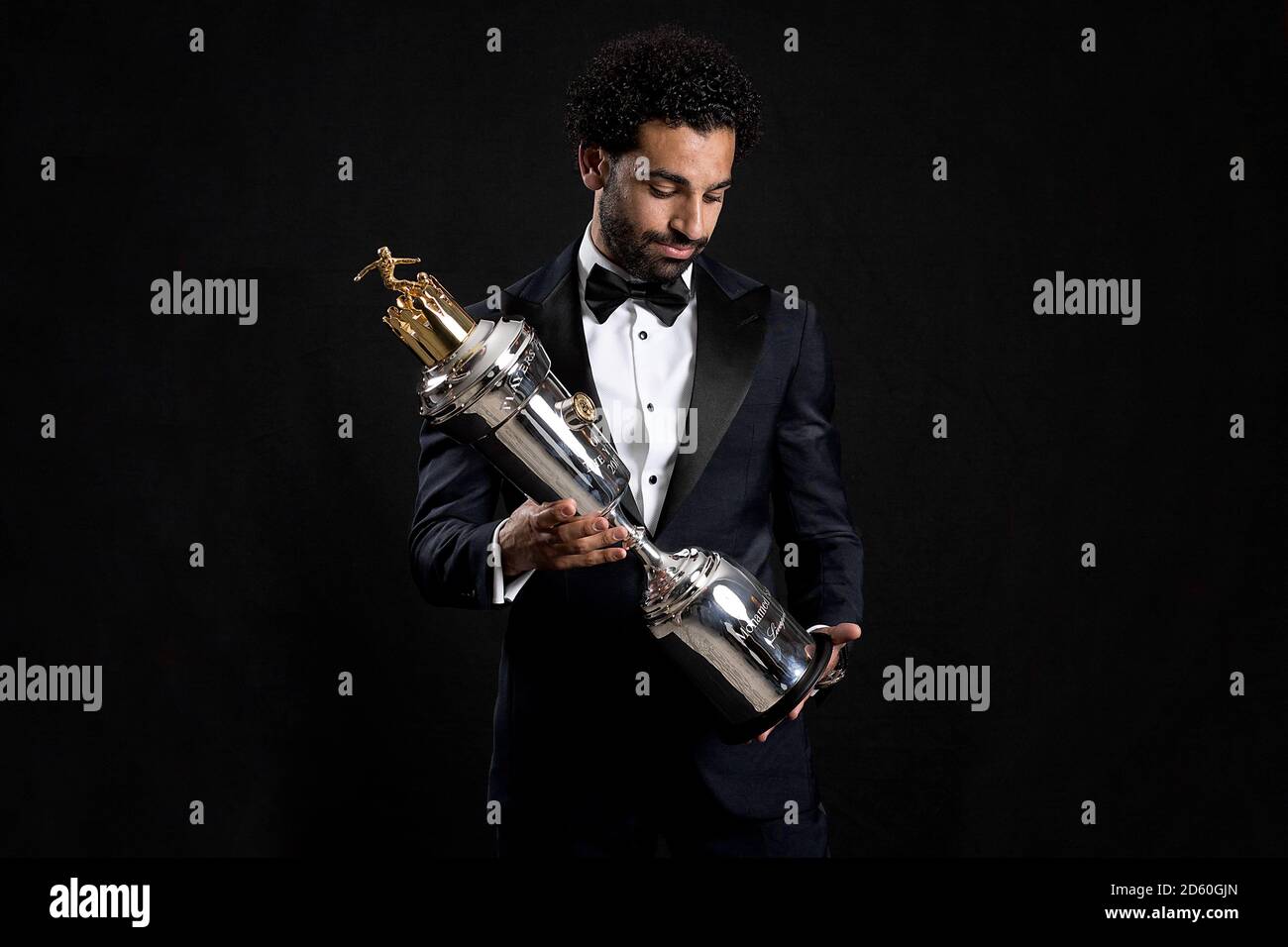 Liverpool's Mohamed Salah poses with the PFA Player Of The Year Award ...
