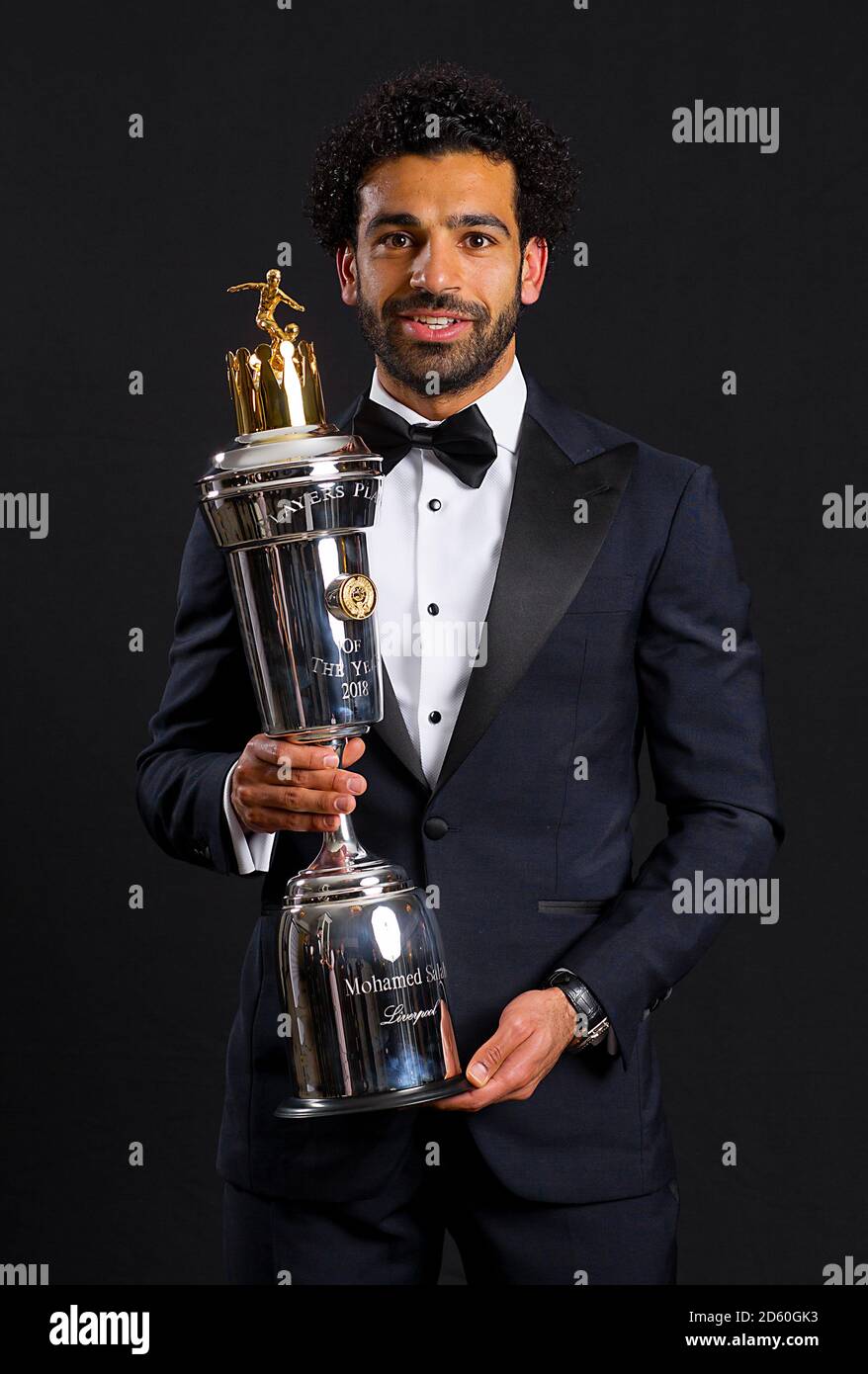 Liverpool's Mohamed Salah poses with the PFA Player Of The Year Award ...