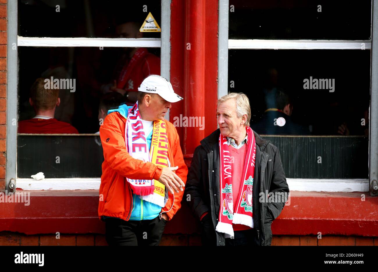 Two football fans talk outside The Albert pub before the Premier League ...