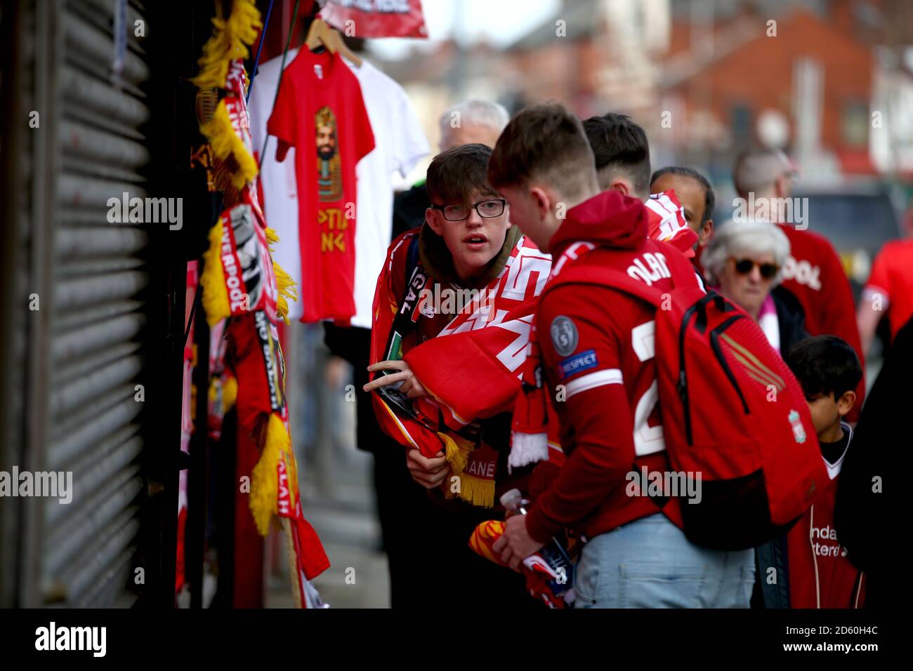 Liverpool fans shop for merchandise from a street vendor before the ...