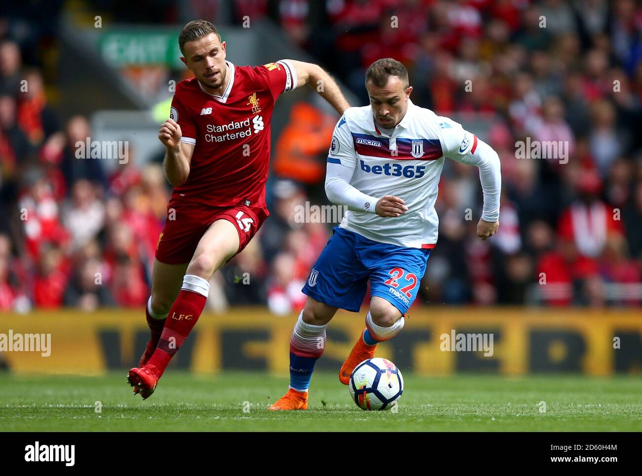 Liverpool's Jordan Henderson (left) and Stoke City's Xherdan Shaqiri ...