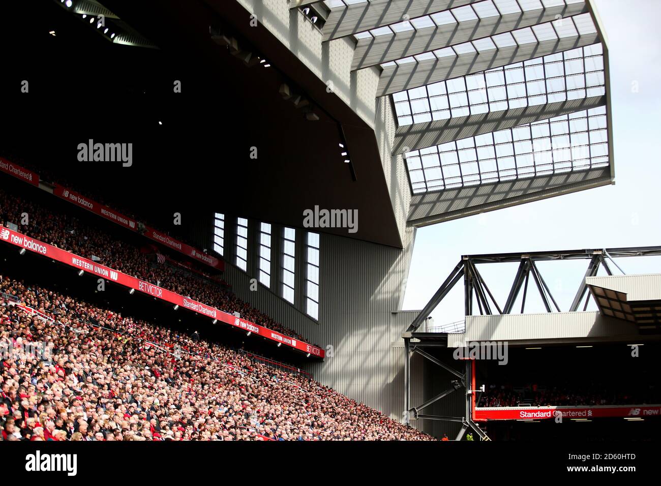 Liverpool fans in the stands Stock Photo - Alamy