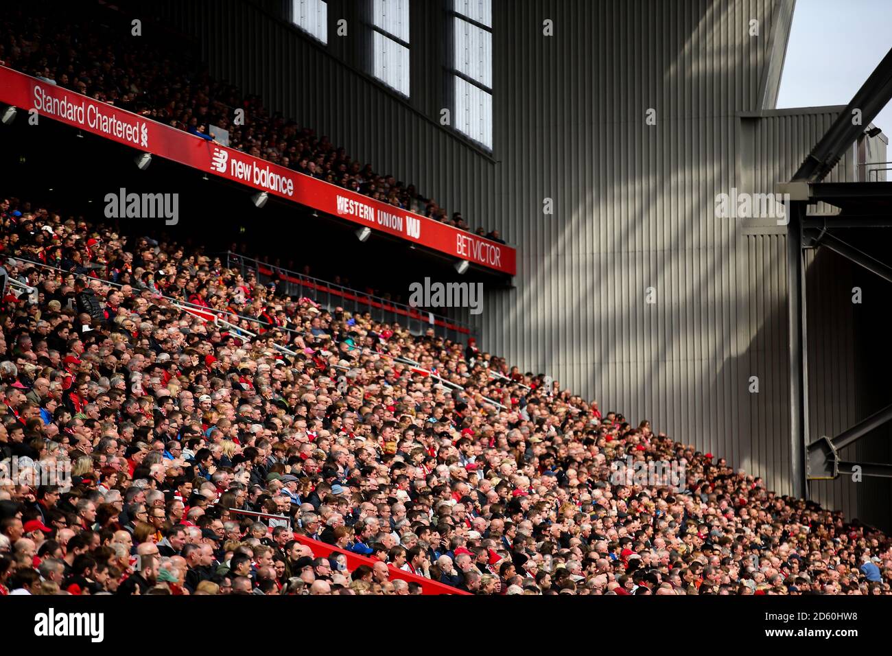 Liverpool fans in the stands Stock Photo - Alamy