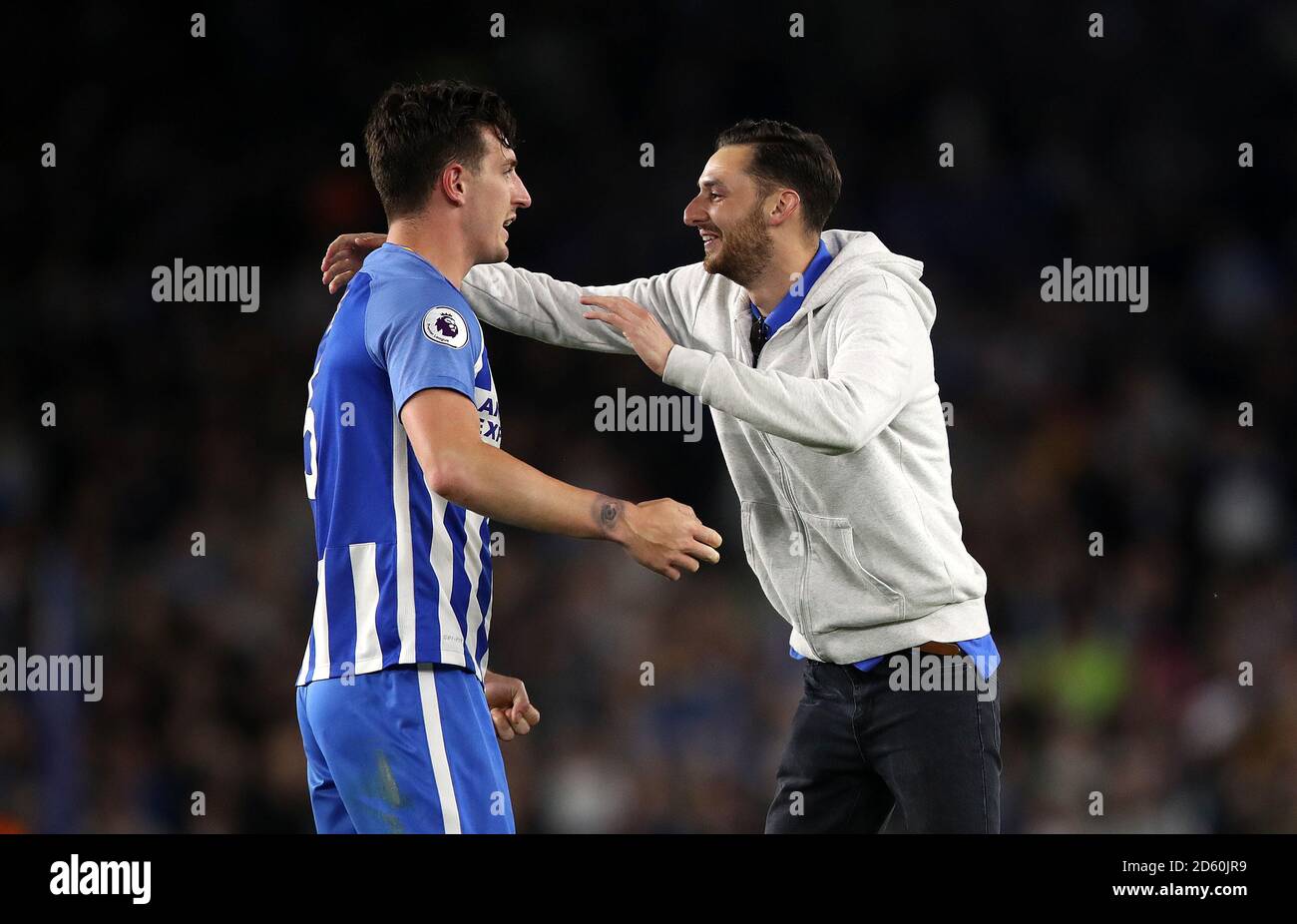 Brighton & Hove Albion's Lewis Dunk (left) celebrates after the final ...