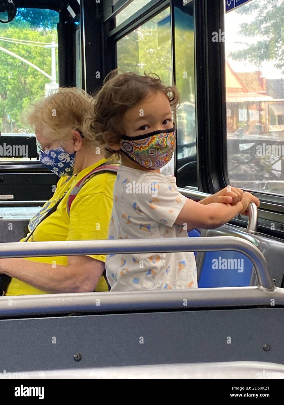 Masked child rides a city bus during the Covid-19 pandemic in Brooklyn ...