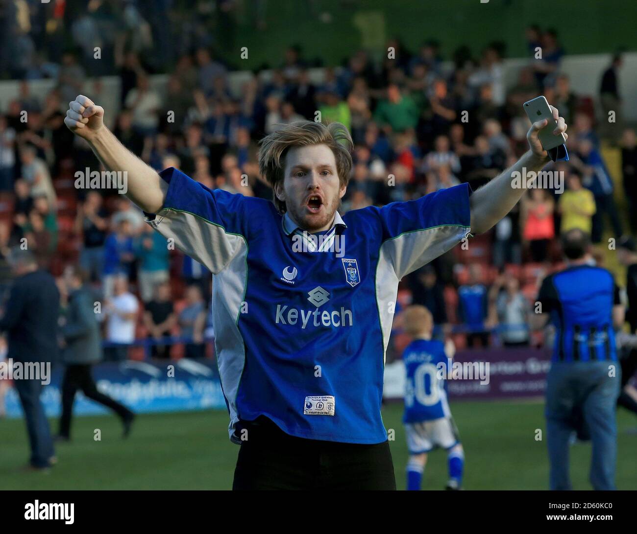 Rochdale fans invade the pitch after the game as their teams win ...