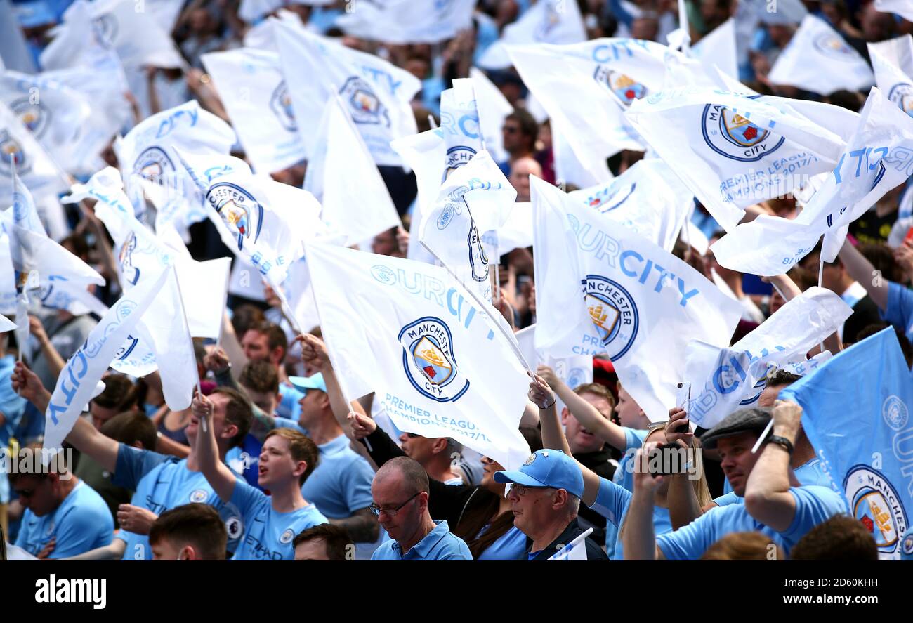Manchester city fans wave flags hi-res stock photography and images - Alamy