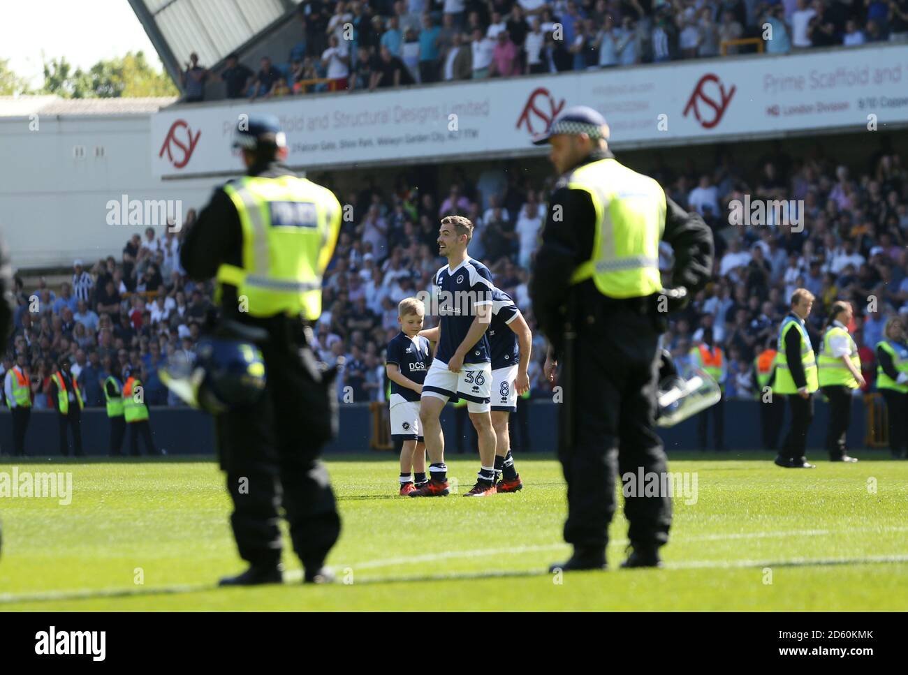 Millwall's Paul Rooney on a lap of apprecitaion with riot police on the ...