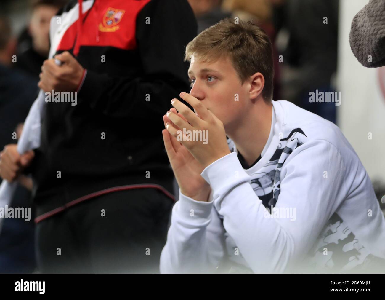 A Swansea City fan reacts after the final whistle Stock Photo - Alamy