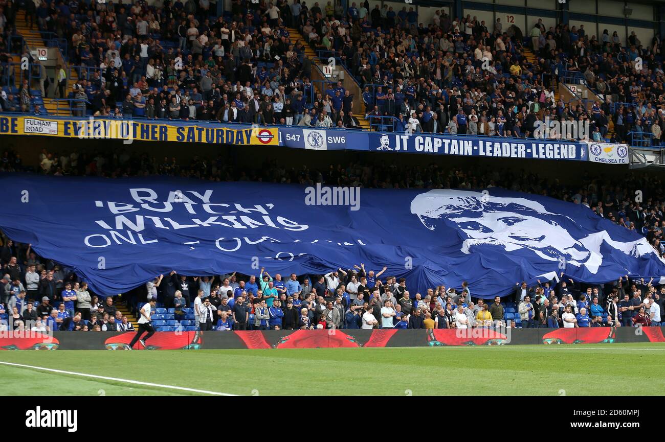 Chelsea fans wave a banner in tribute to Ray Wilkins in the stands ...