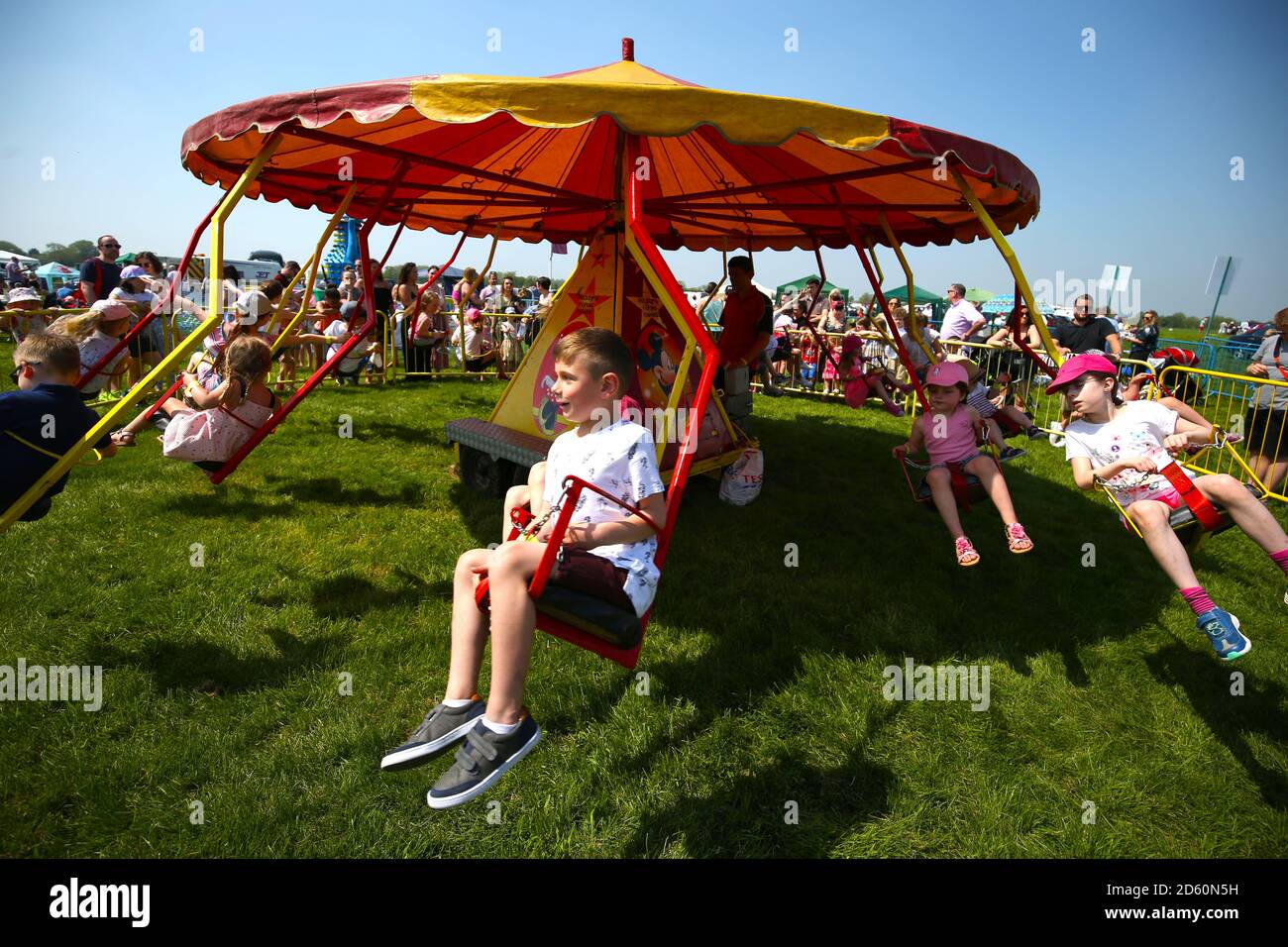 Racegoers enjoy the fairground rides during Kids Carnival Day at ...
