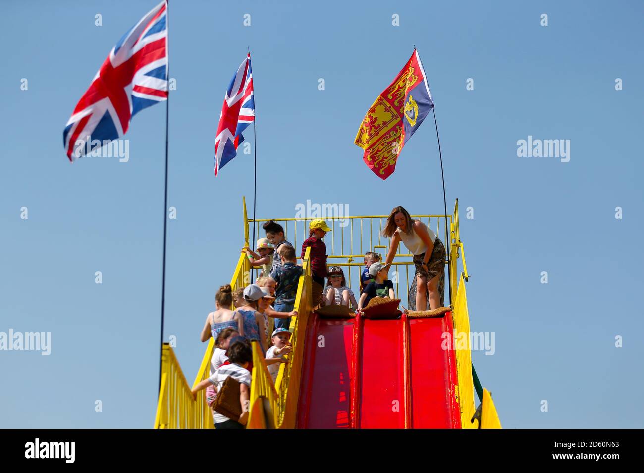 Racegoers enjoy the astroslide during Kids Carnival Day at warwick ...