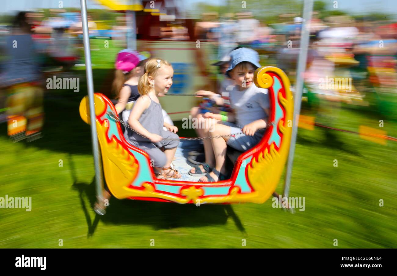 Children enjoy the carousel during Kids Carnival Day at warwick Races ...