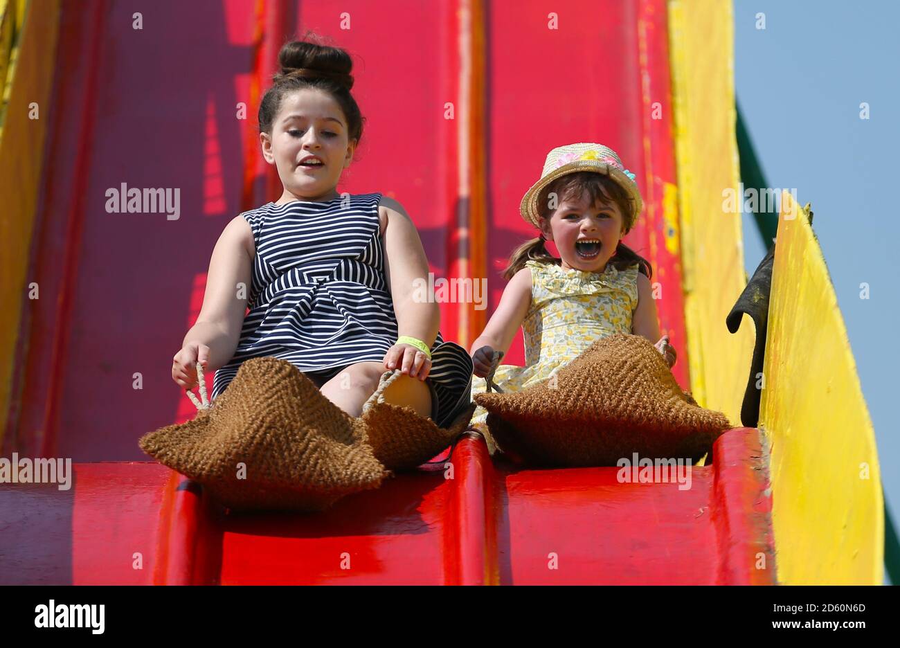 Racegoers enjoy the astroslide during Kids Carnival Day at warwick ...