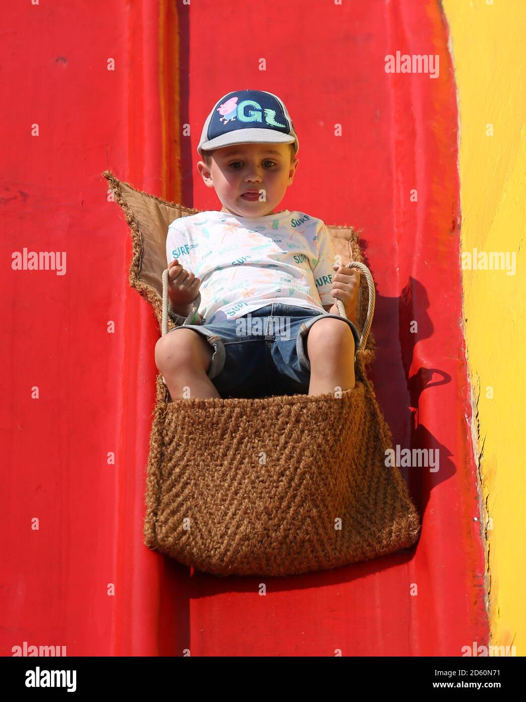 Racegoers enjoy the astroslide during Kids Carnival Day at warwick ...