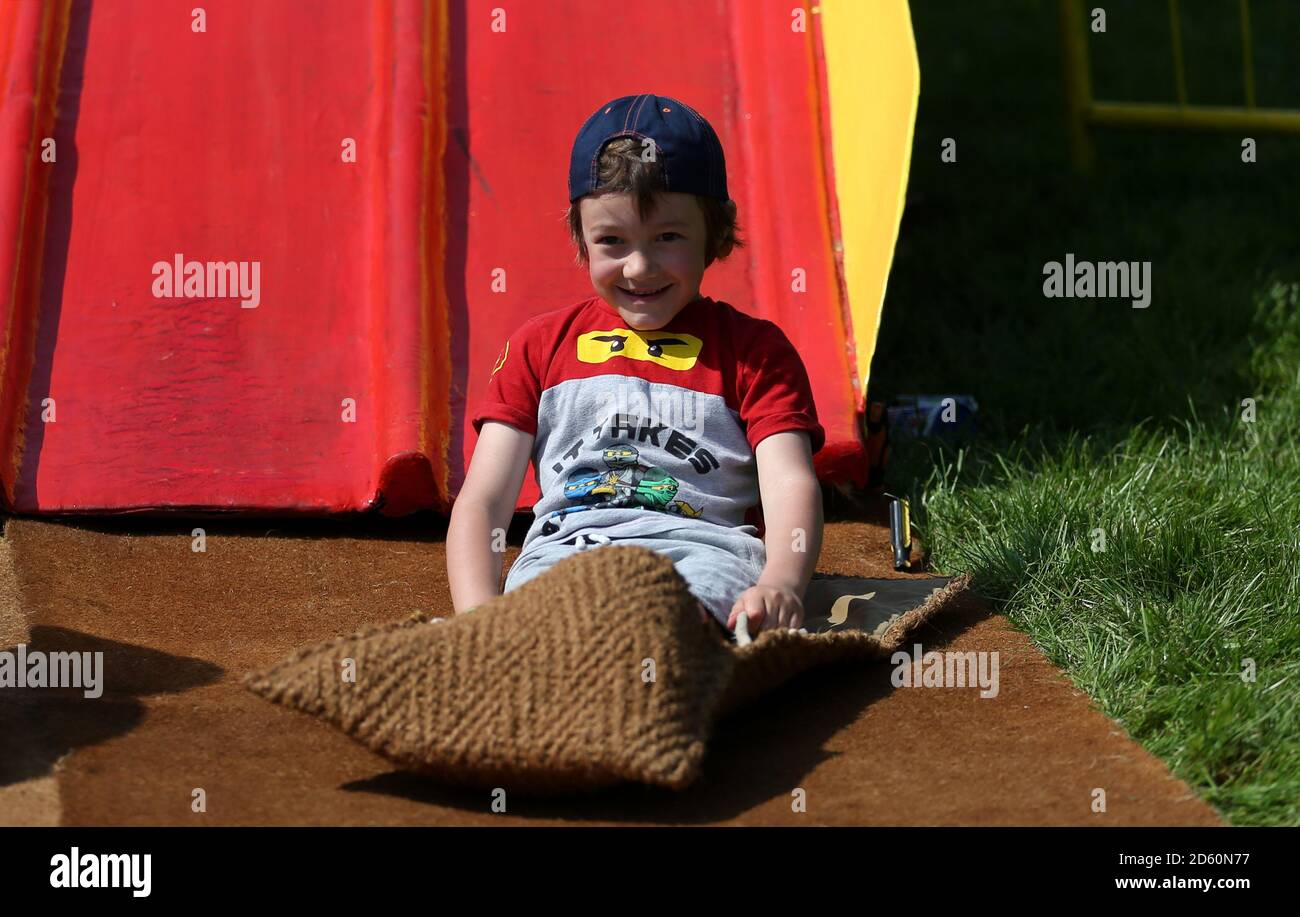Racegoers enjoy the astroslide during Kids Carnival Day at warwick ...