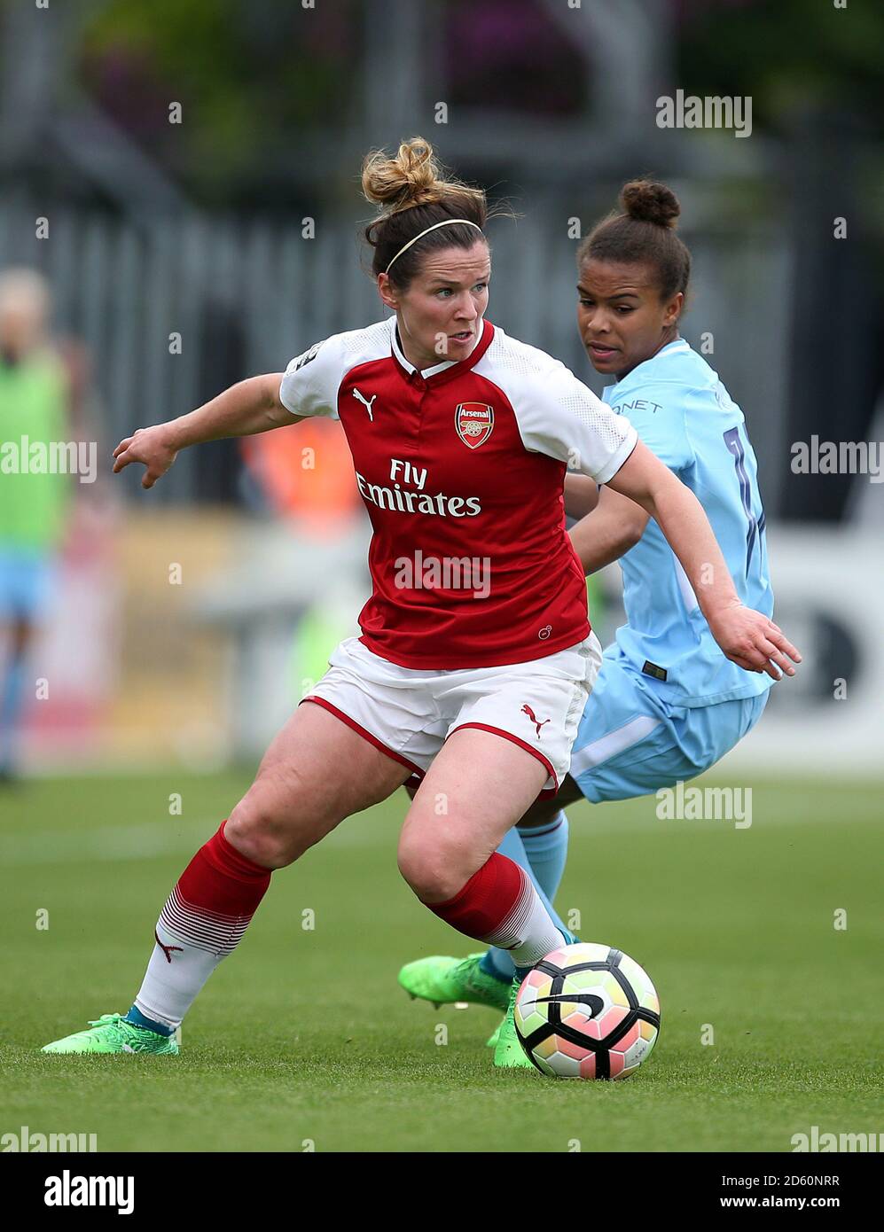 Arsenal's Emma Mitchell and Manchester City's Nikita Parris in action ...